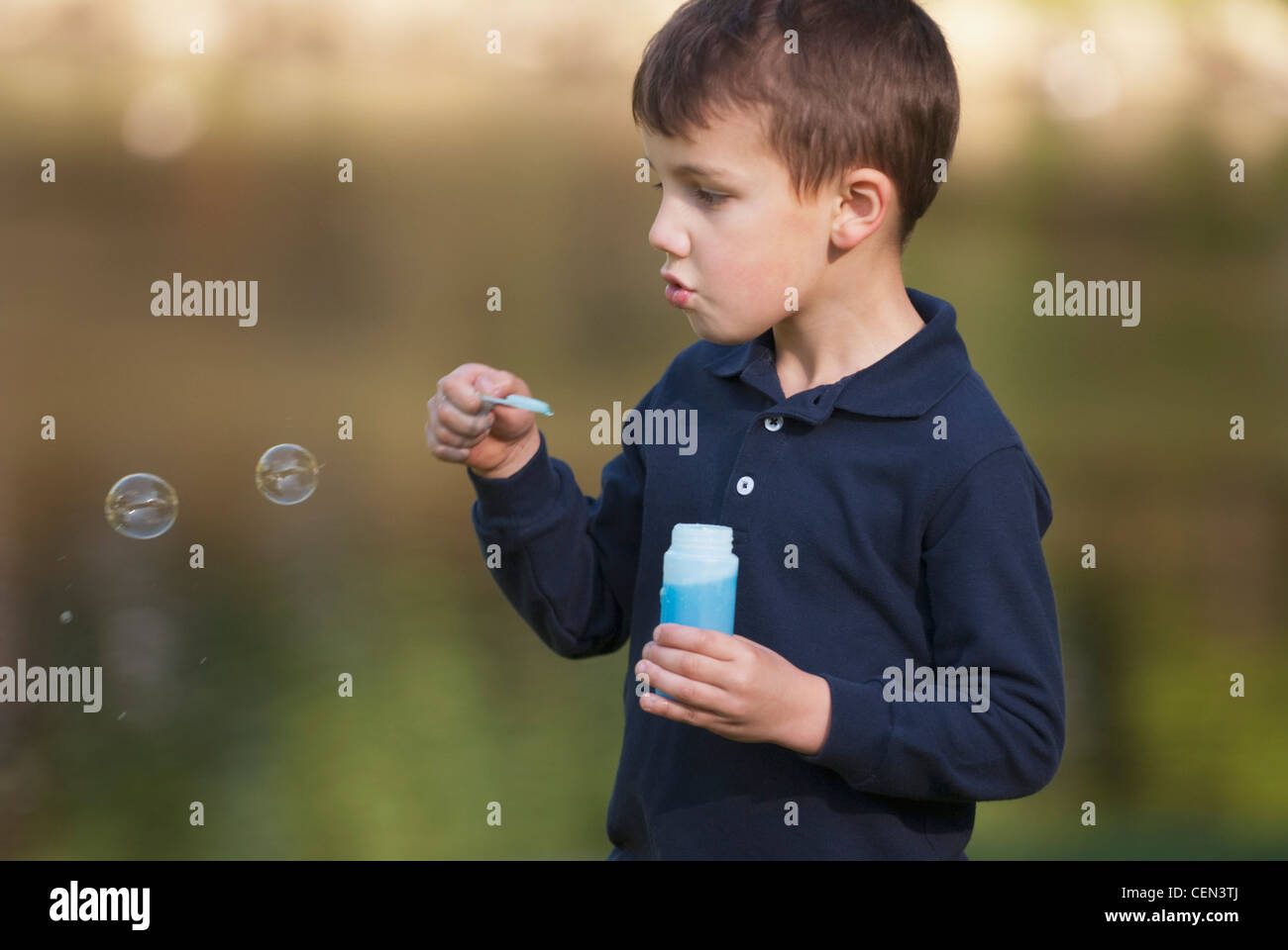 Five Year Old Boy Blowing Bubbles Stock Photo - Alamy