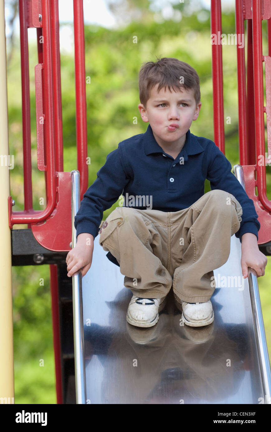 Boy On A Slide Stock Photo - Alamy
