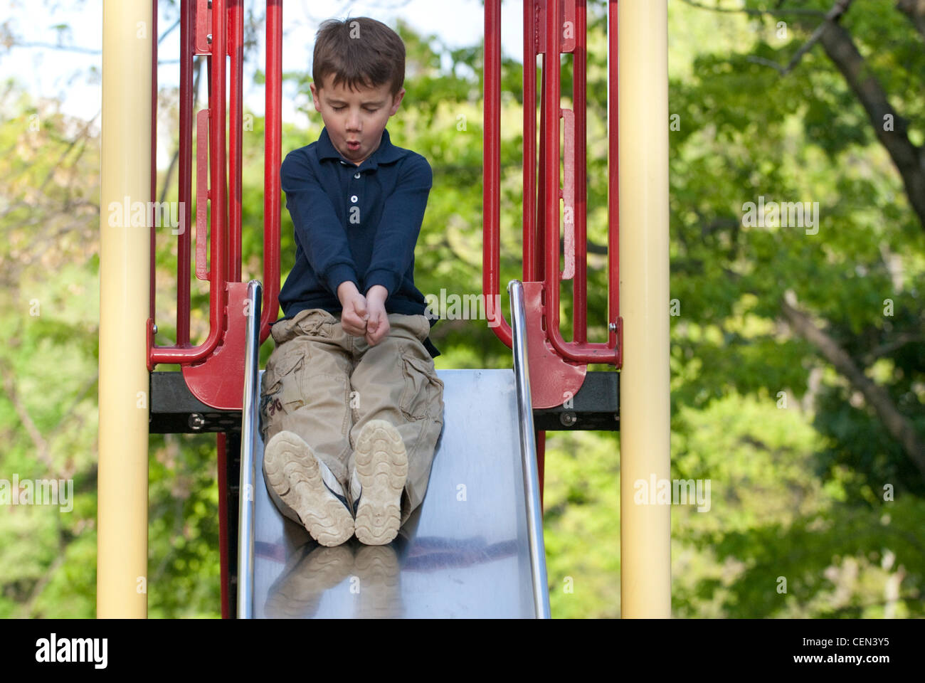 Sitting on slides hi-res stock photography and images - Alamy
