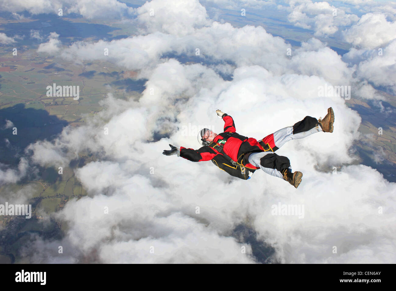 Skydiver falls through the air on his back Stock Photo - Alamy