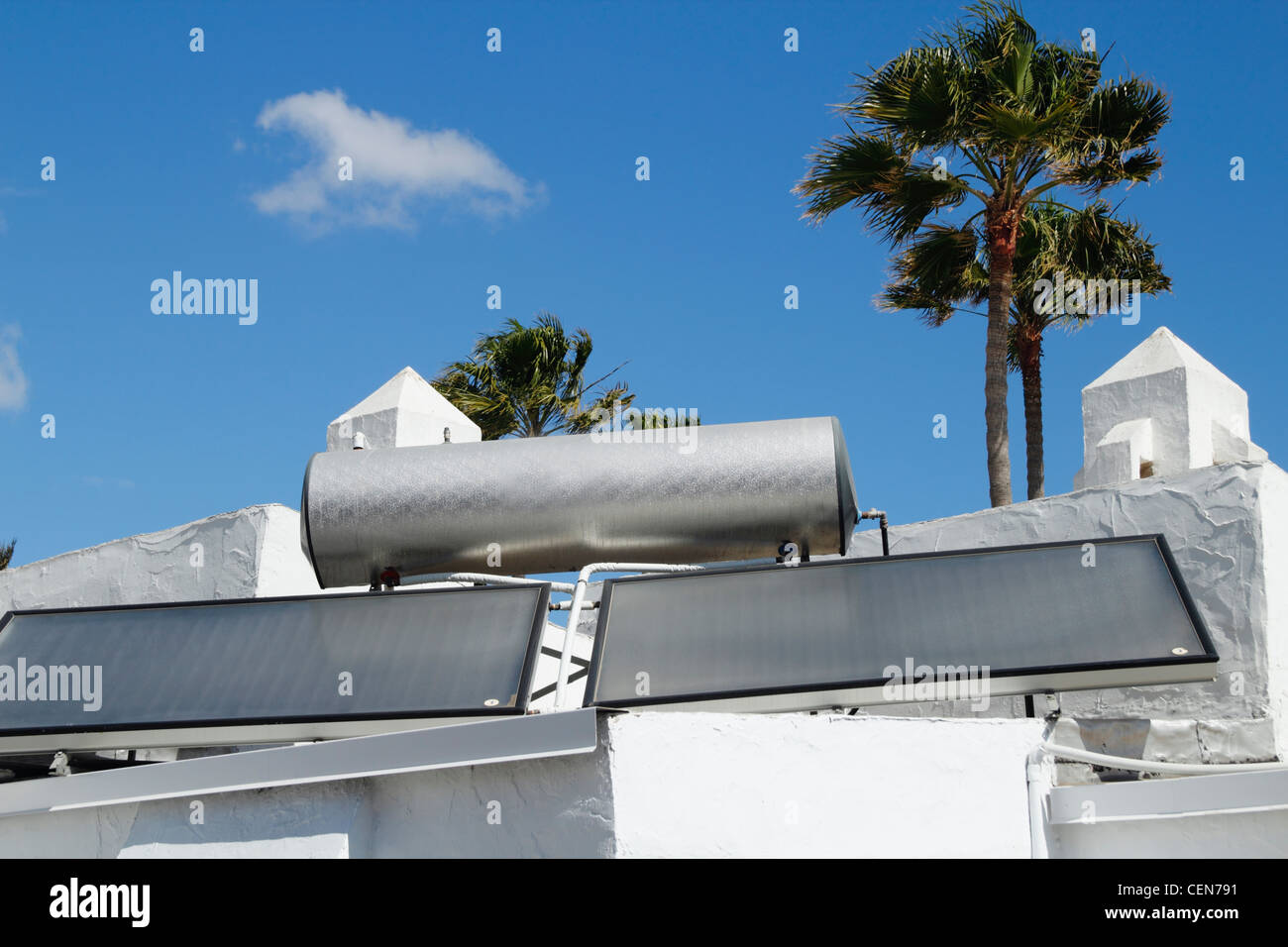 Solar panels and water tank on roof of house in Spain Stock Photo - Alamy