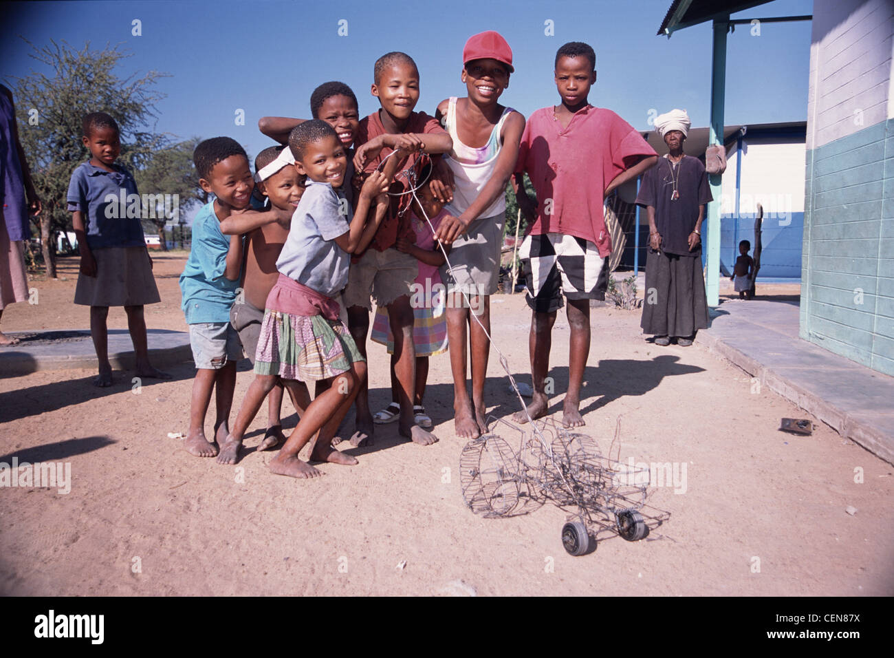 Namibian children playing with wire toy car in the town of Khorixas ...