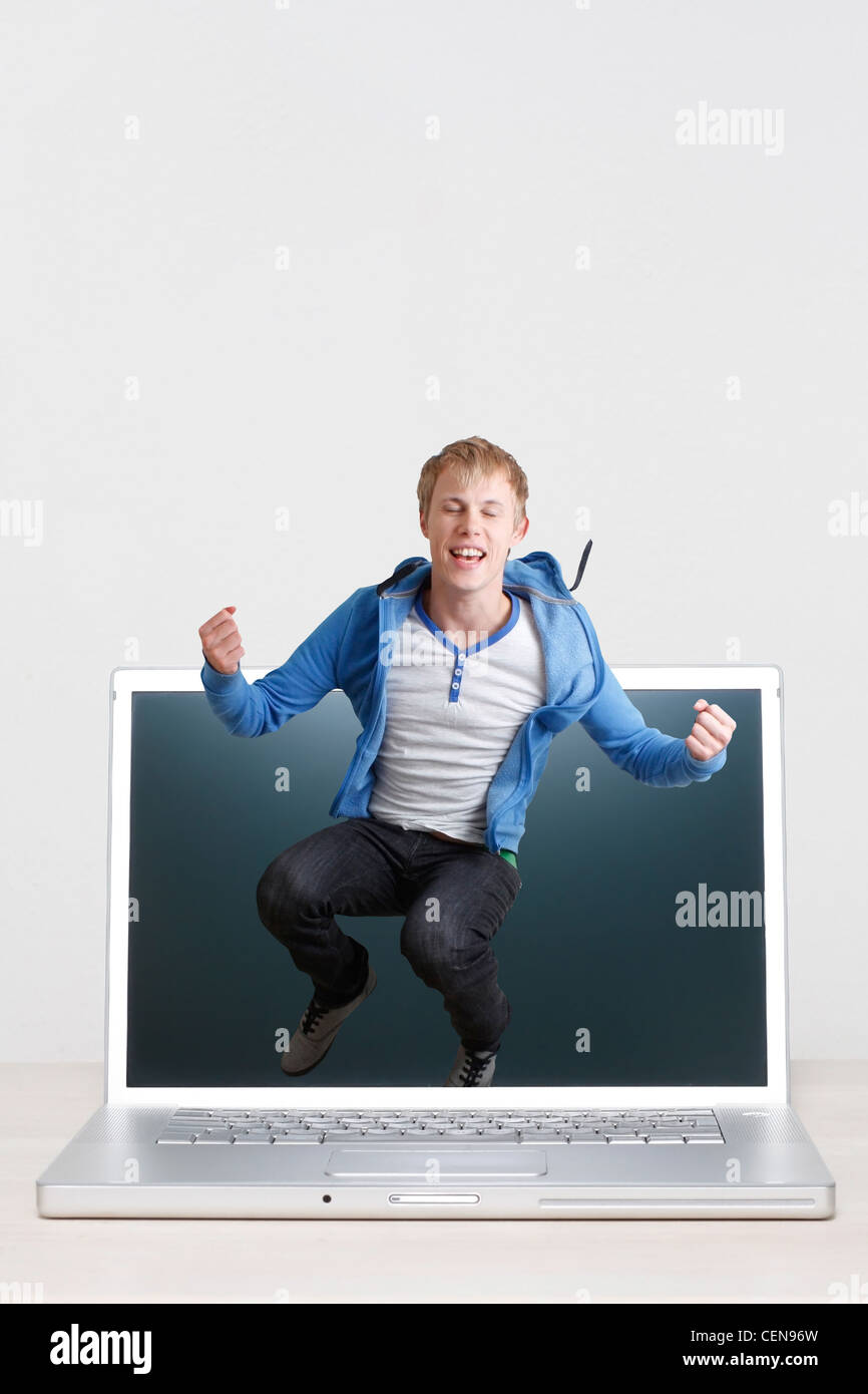 A teenager jumping off a screen Stock Photo - Alamy