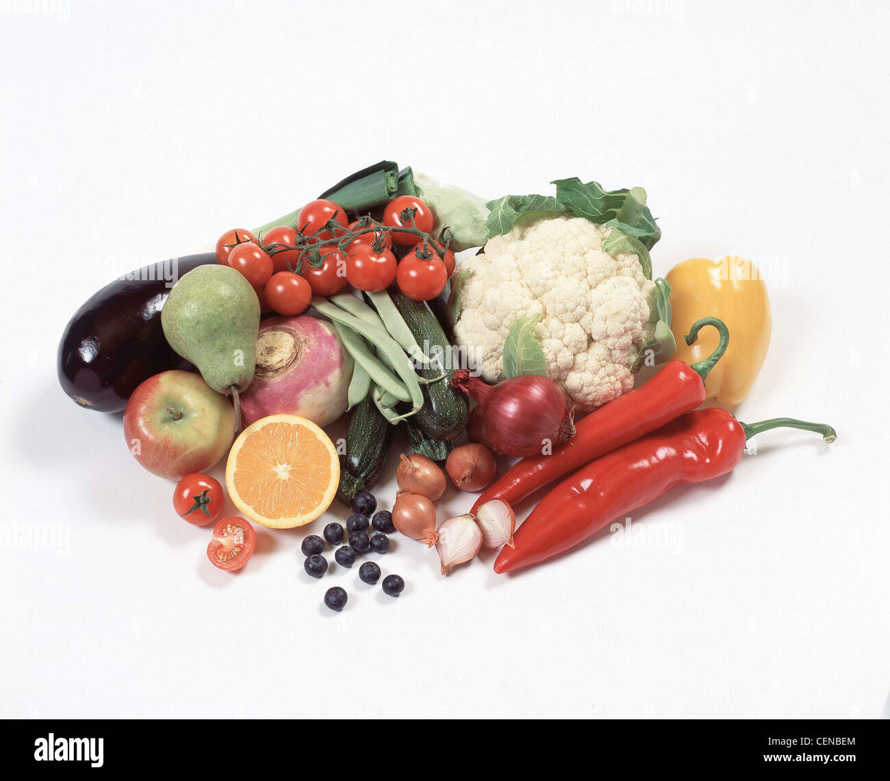 A selection of mixed fruit and vegetables including tomatoes chillies ...