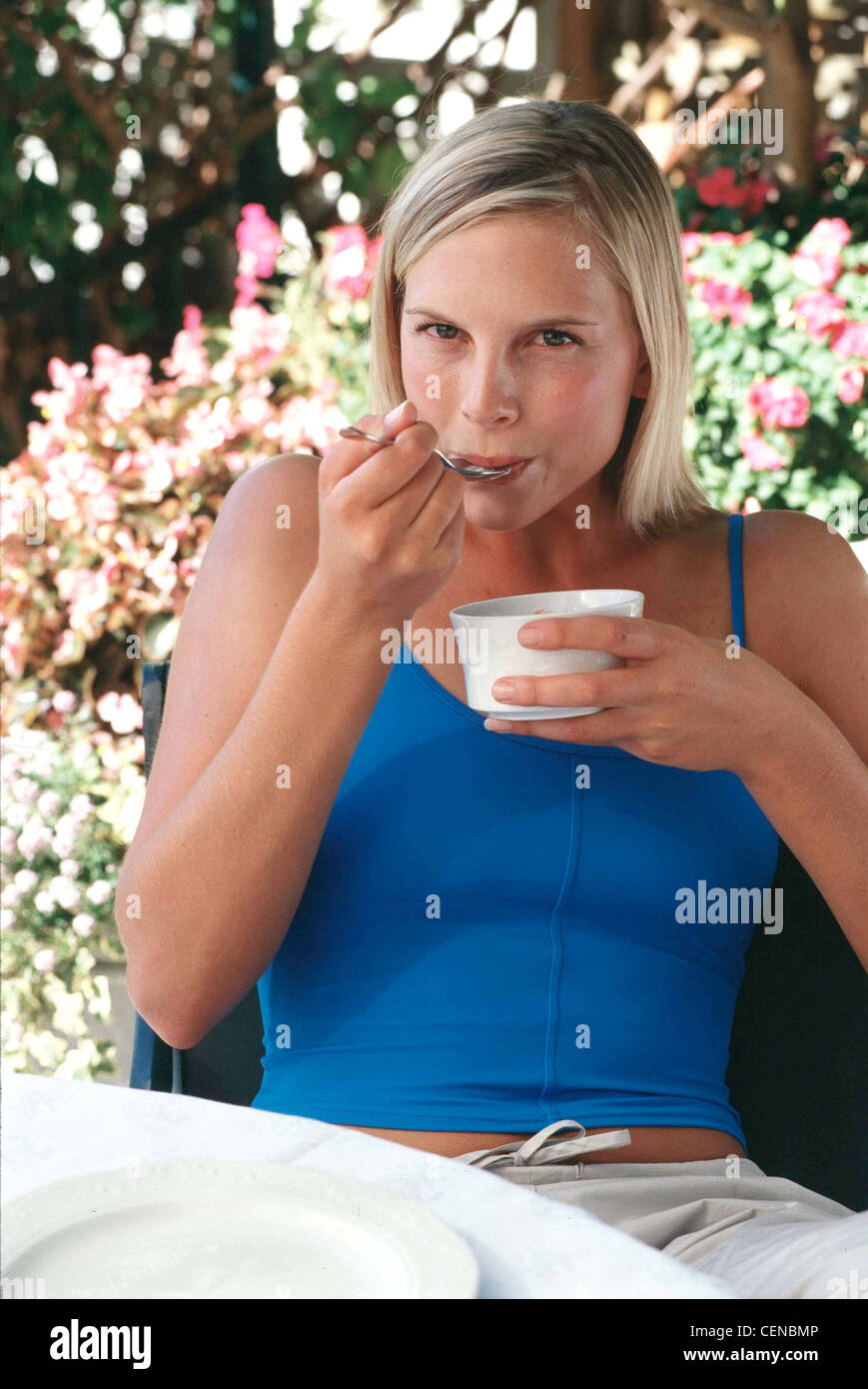 Tanned Female Chin Length Blonde Hair Wearing Subtle Make Up Cropped