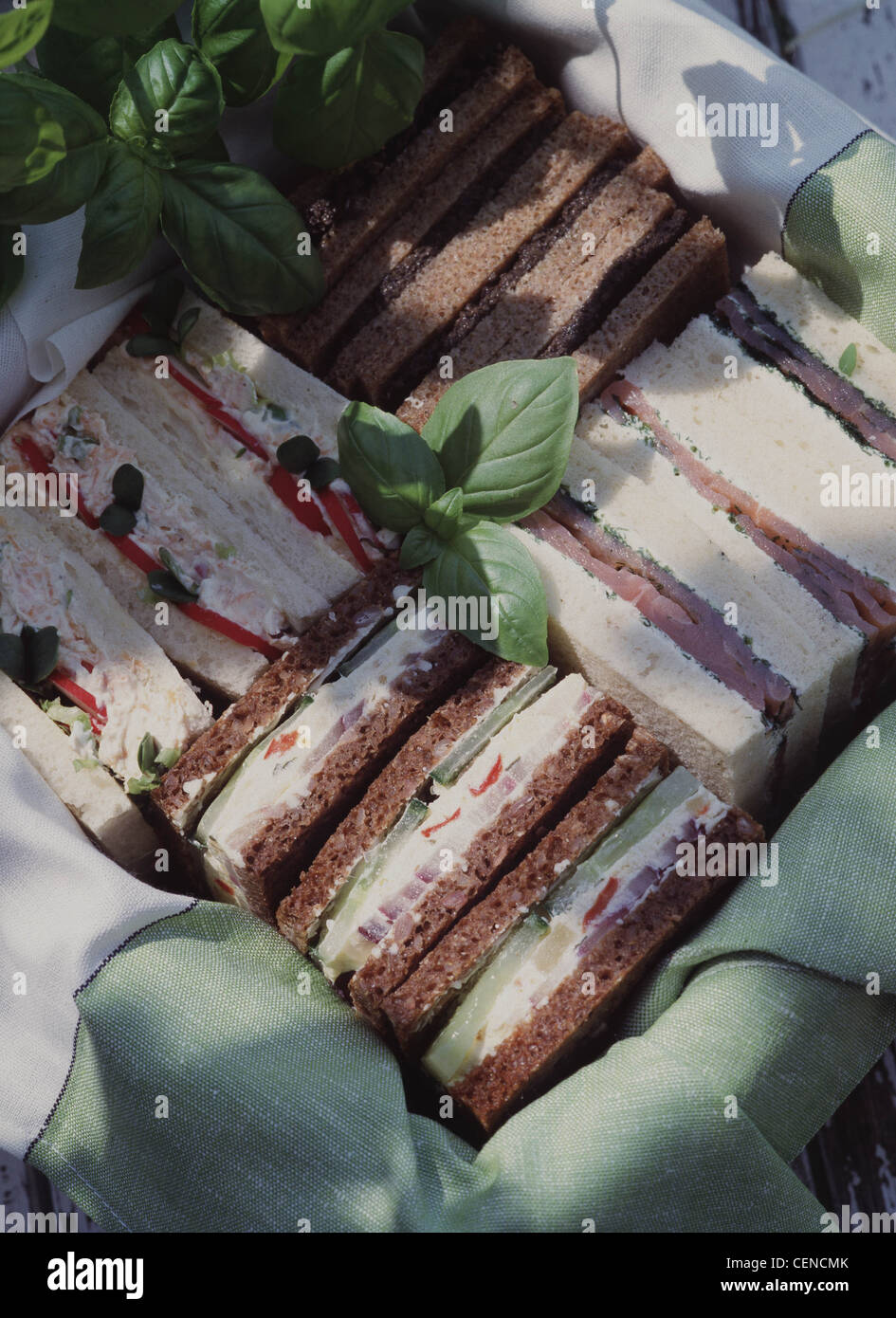 Picnic Sandwiches; Layered sandwhiches using black and white bread four ...