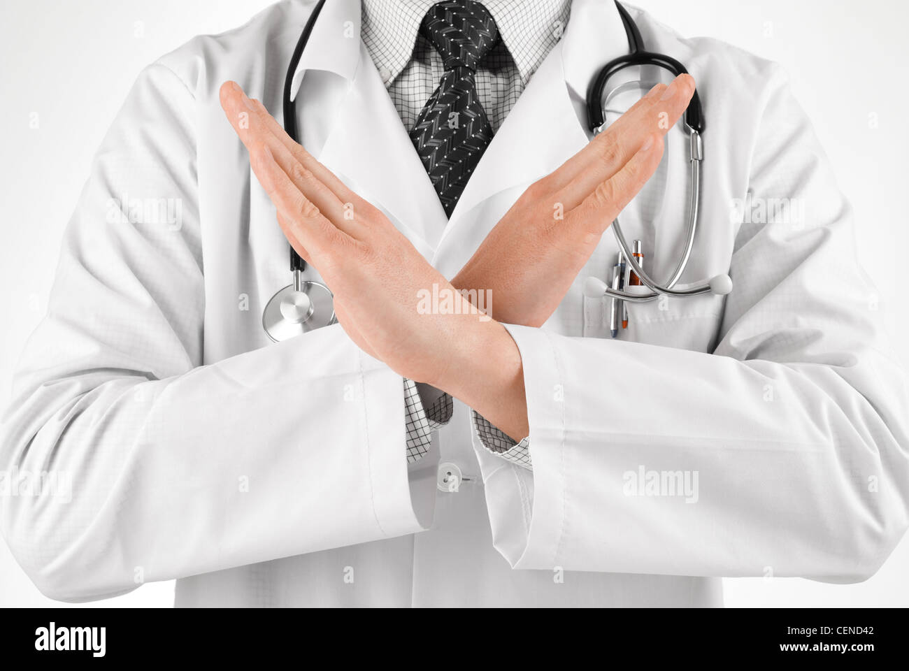 Doctor in black tie with stethoscope showing refusal sign Stock Photo ...
