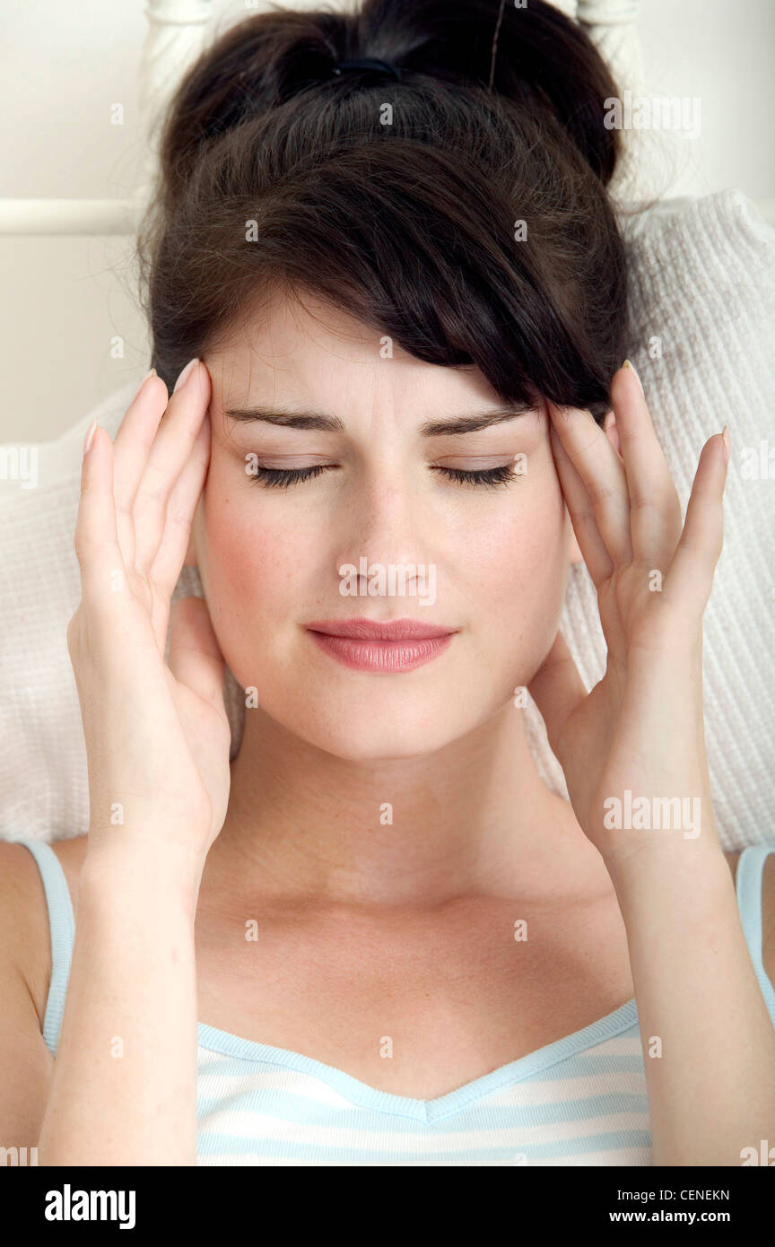 Female brunette hair off face wearing blue and white striped vest top ...