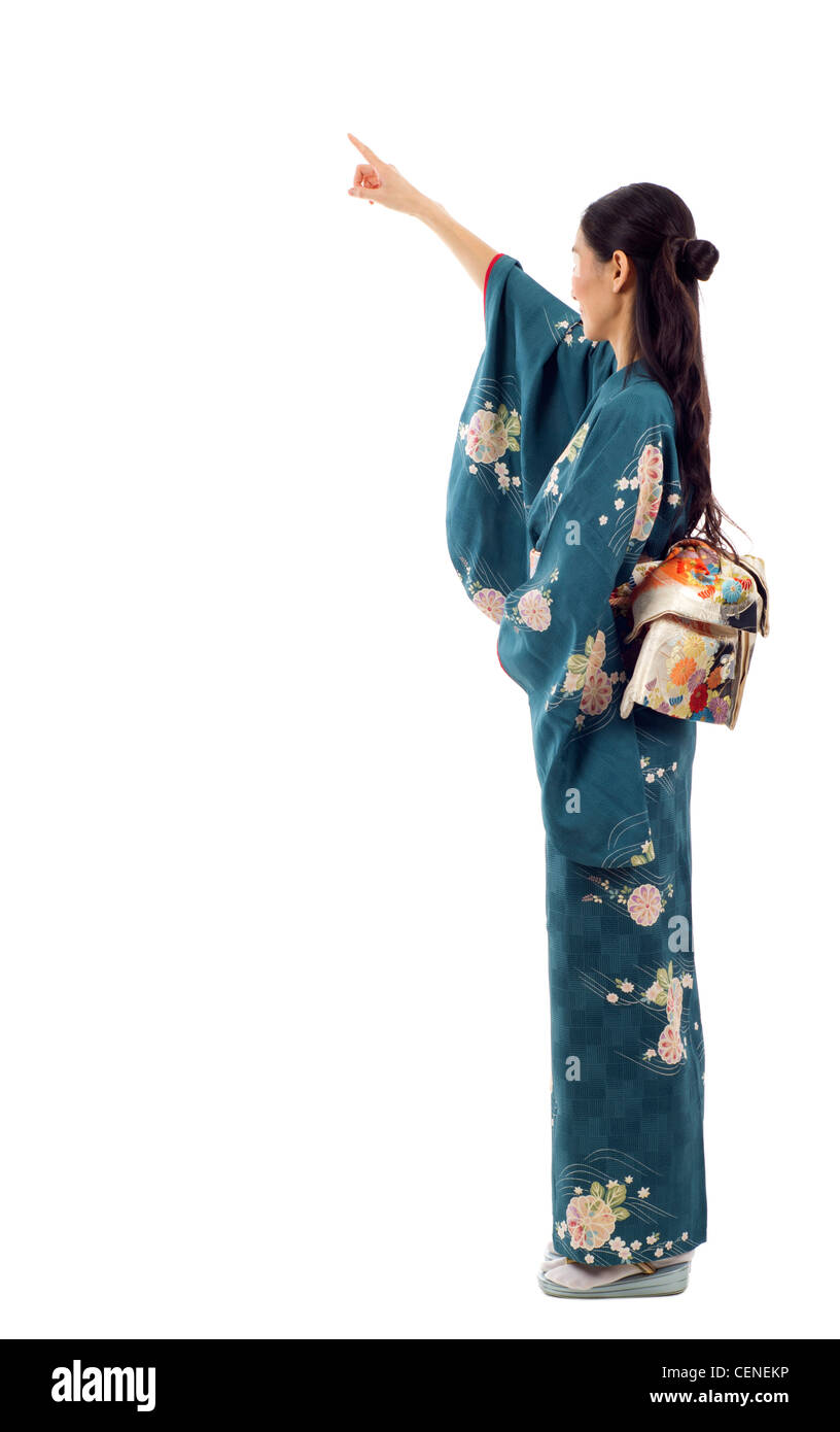Full length of Japanese kimono woman pointing at copyspace isolated ...