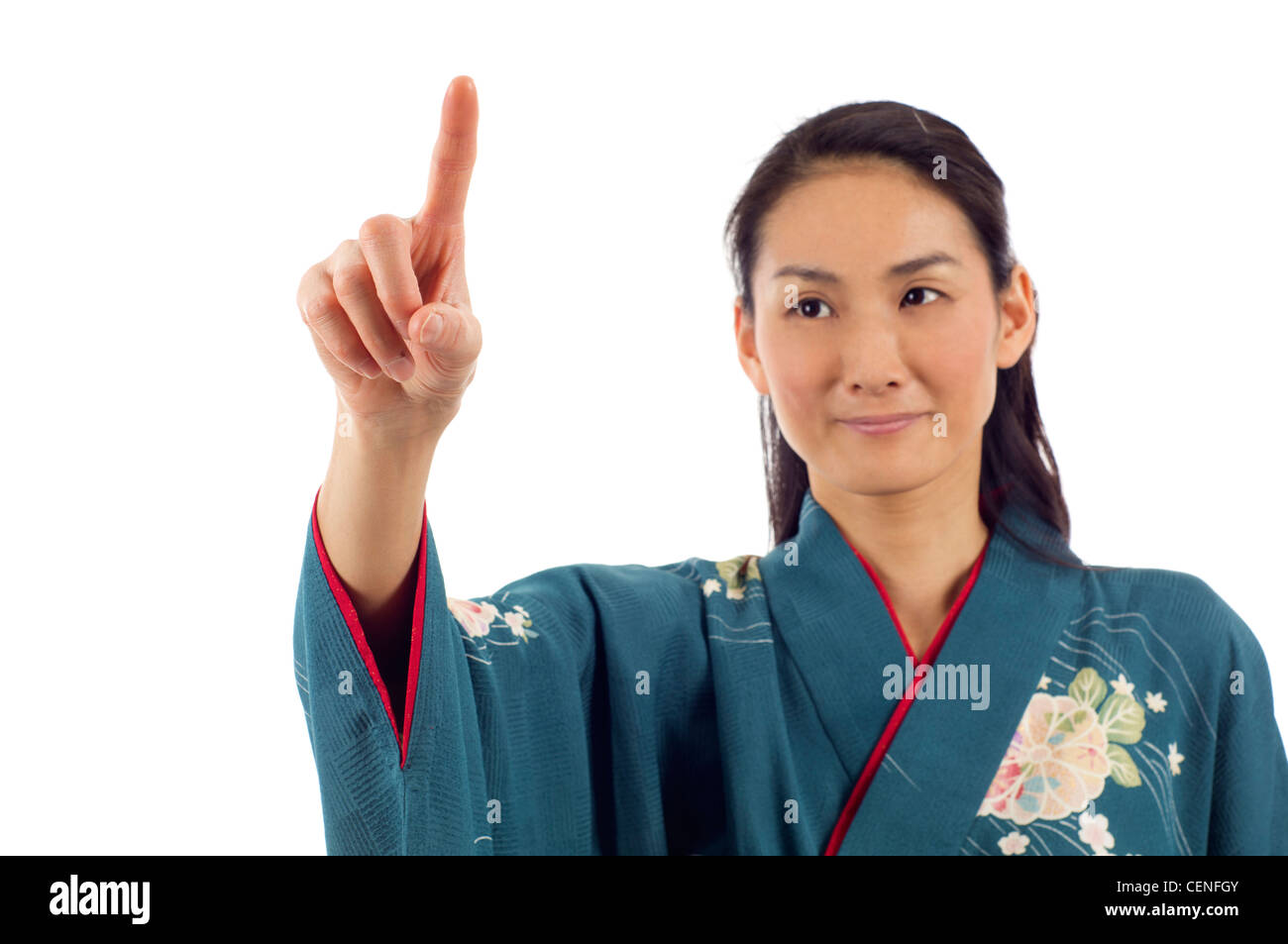 Japanese woman in kimono pointing her finger on imaginery virtual ...