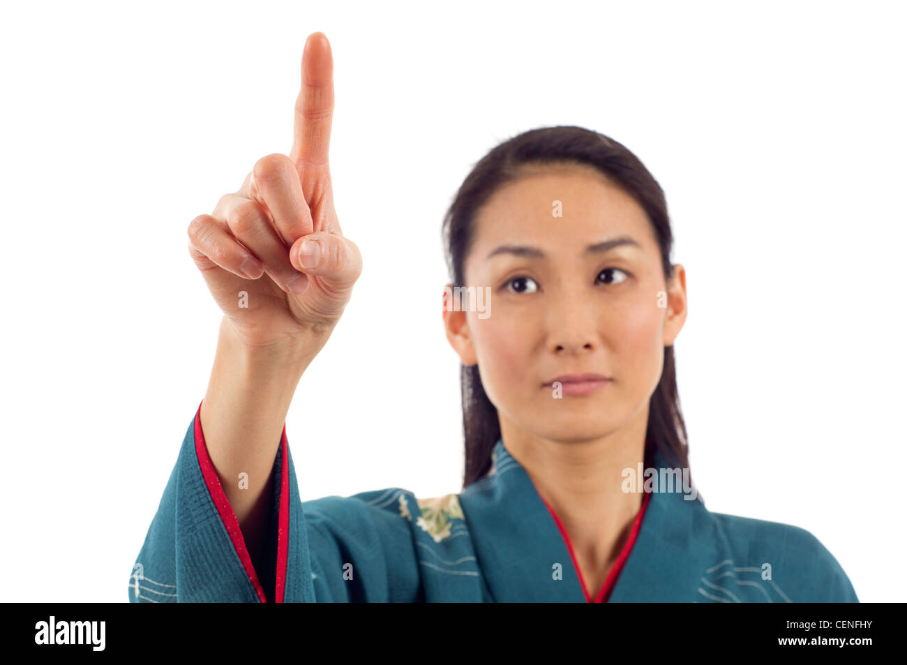 Japanese woman in kimono pointing her finger on imaginery virtual ...