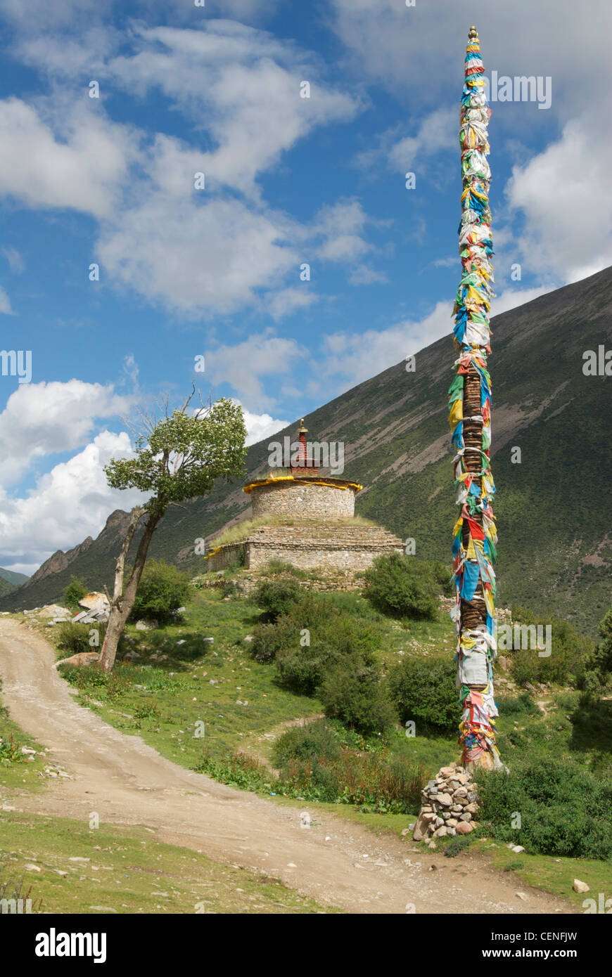 Flag pole and Chorten Reting Monastery Stock Photo - Alamy