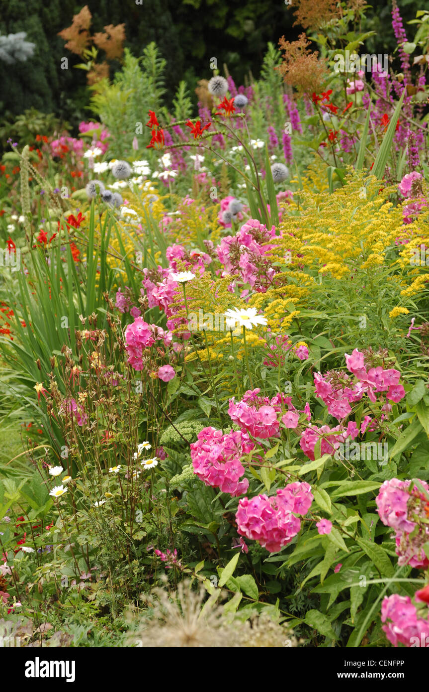 All Seasons Garden Mixed perennial border with pink Phlox flowers ...