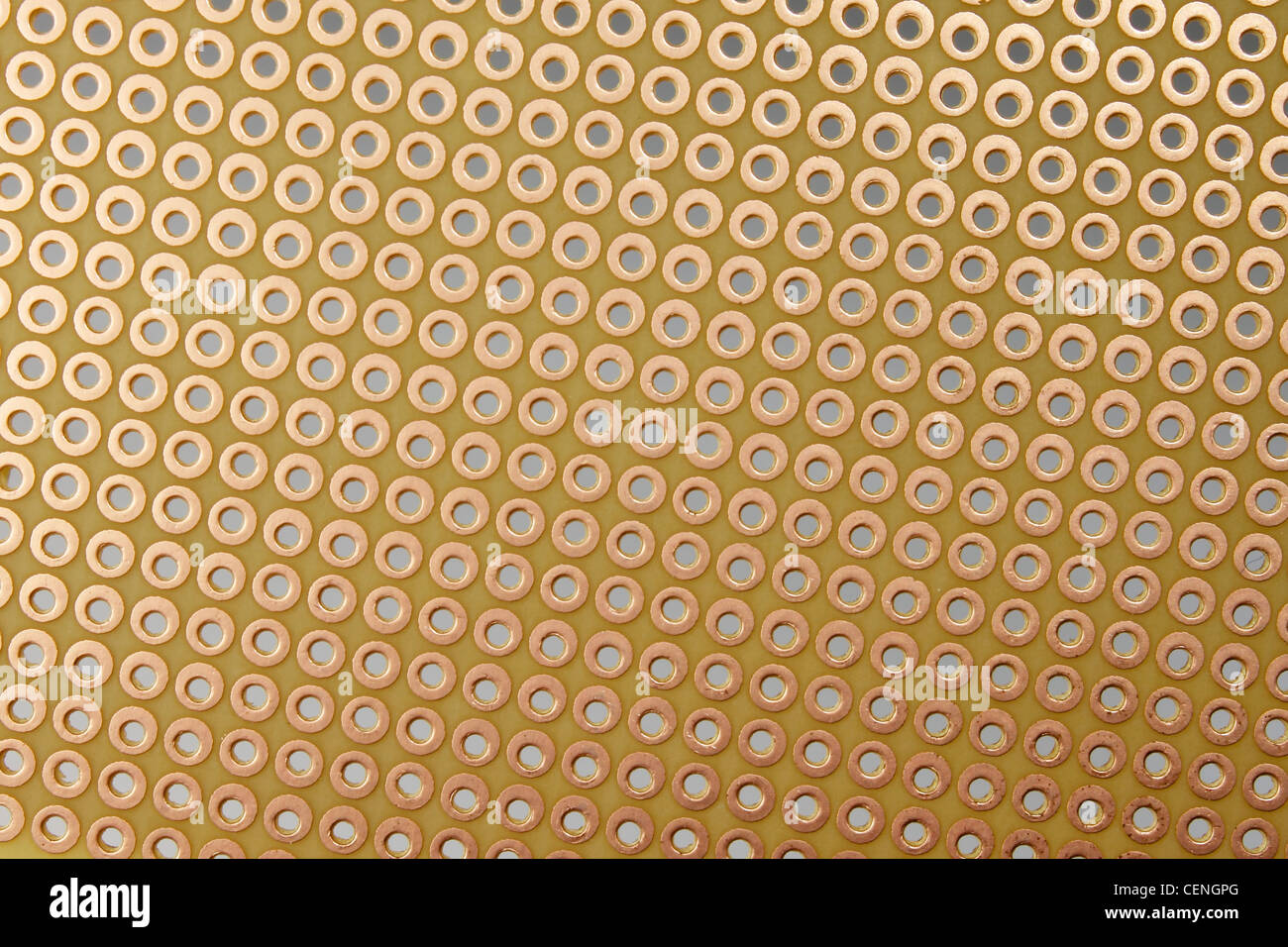 Hole grid board for soldering devices Stock Photo - Alamy
