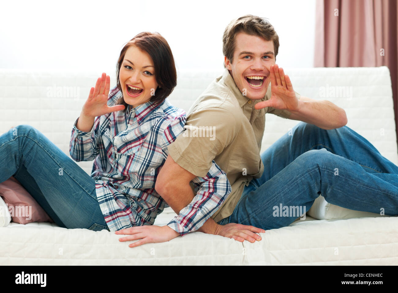 Cheerful couple having fun at home Stock Photo - Alamy