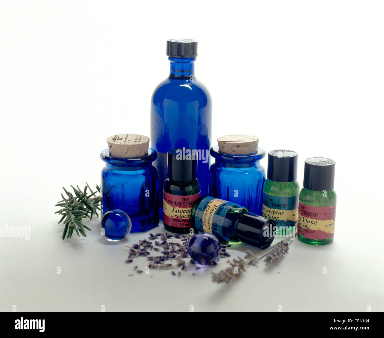 Group of aromatherapy oils in small bottles, blue bottles cork lids ...