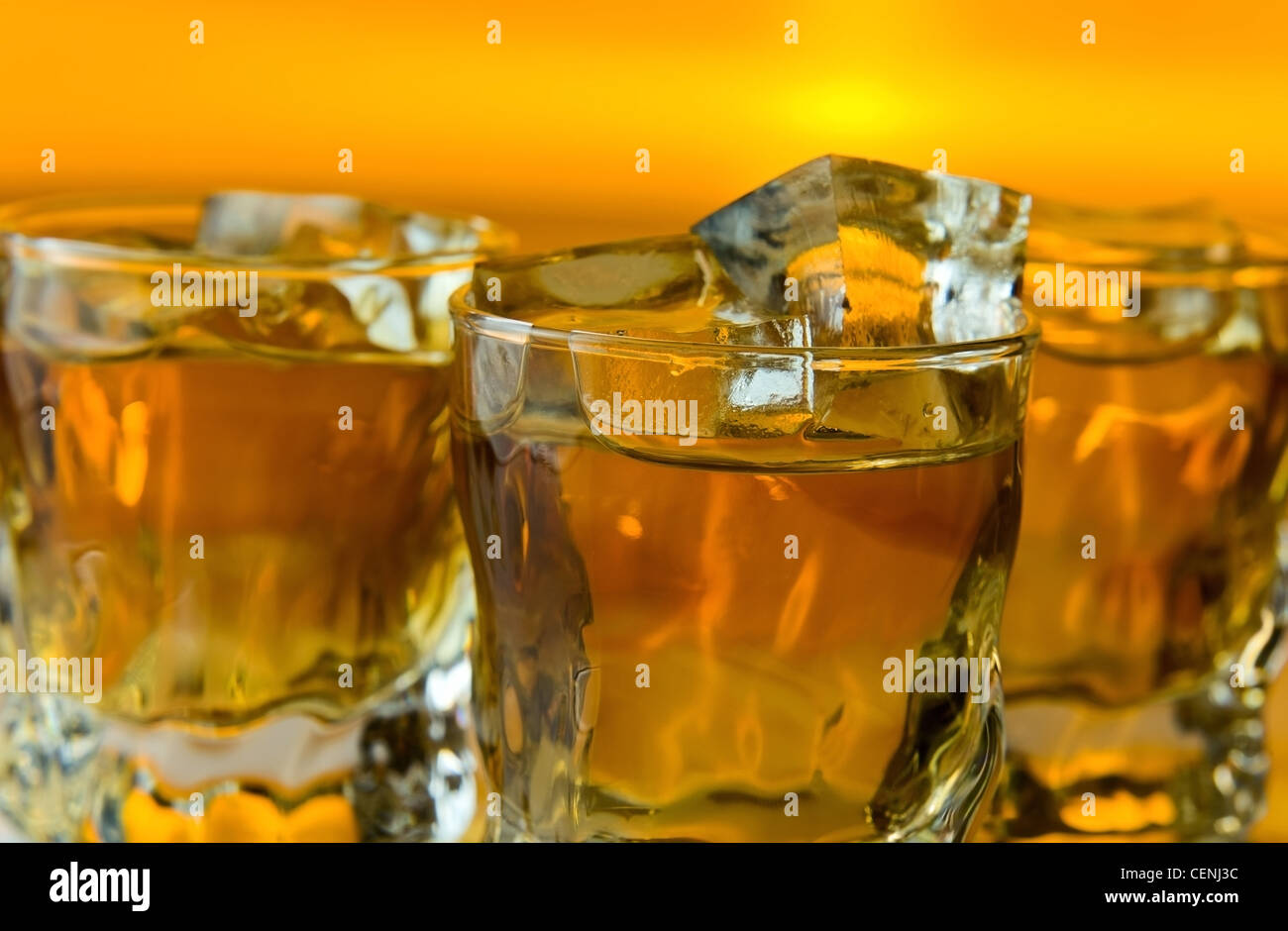 whisky with ice , focus on a foreground Stock Photo - Alamy