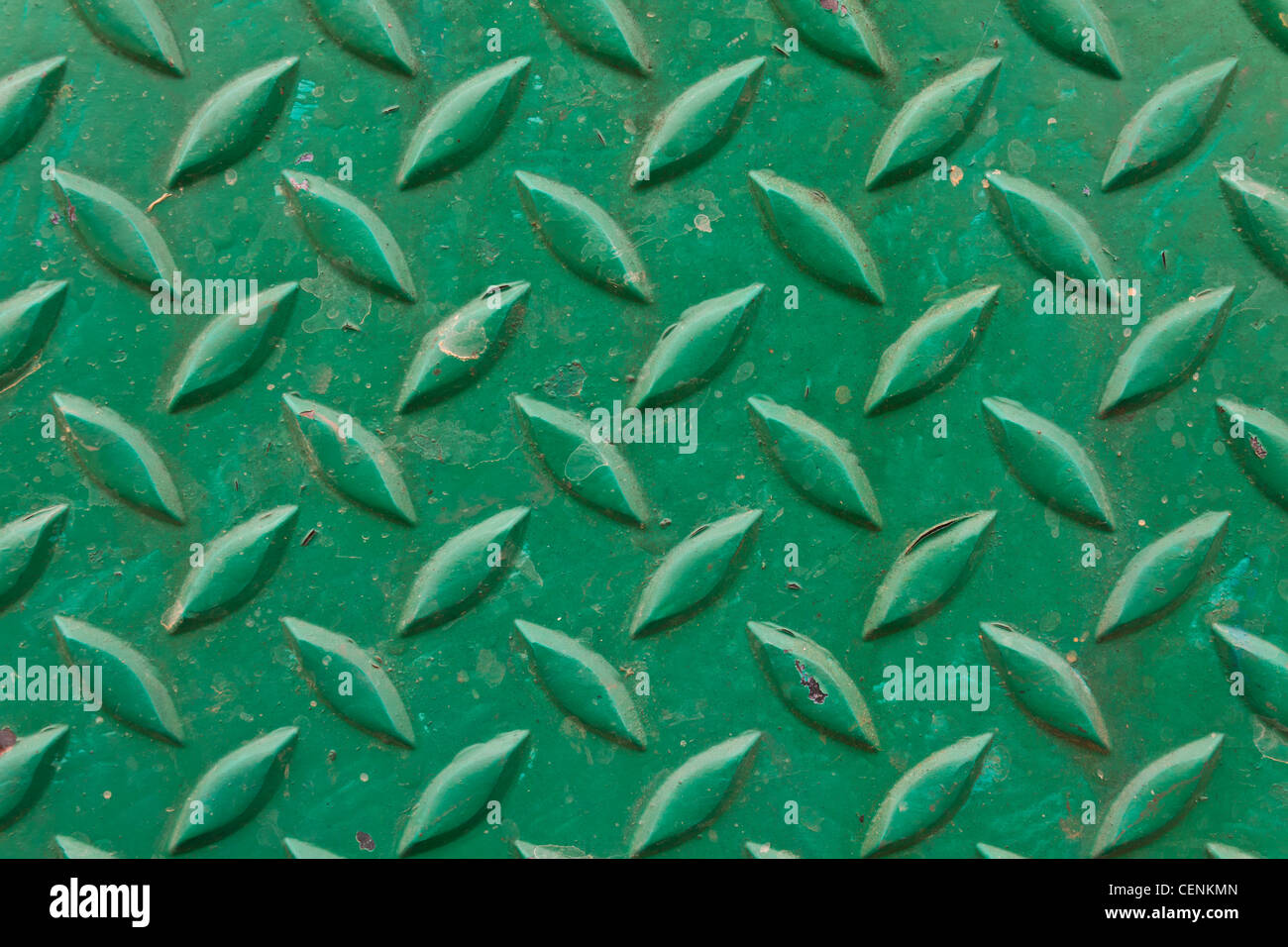 Diamond metal painted green on piece of background Stock Photo - Alamy