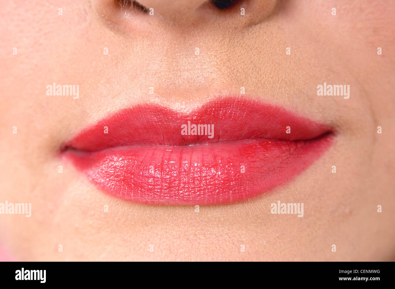 Close up of bright red Female lips half smiling Stock Photo - Alamy