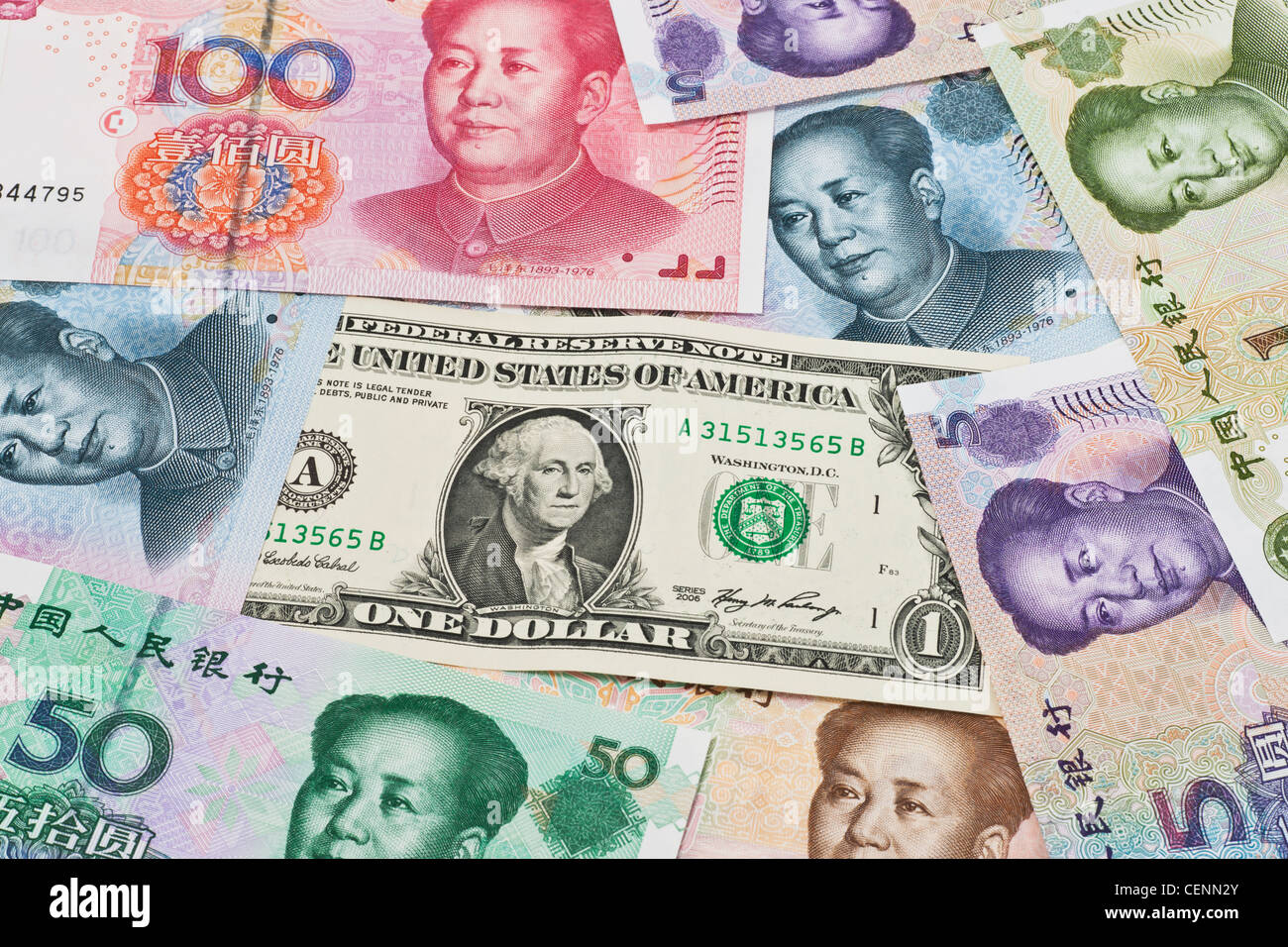 Many Yuan bills with the portrait of Mao Zedong lying side by side. In ...