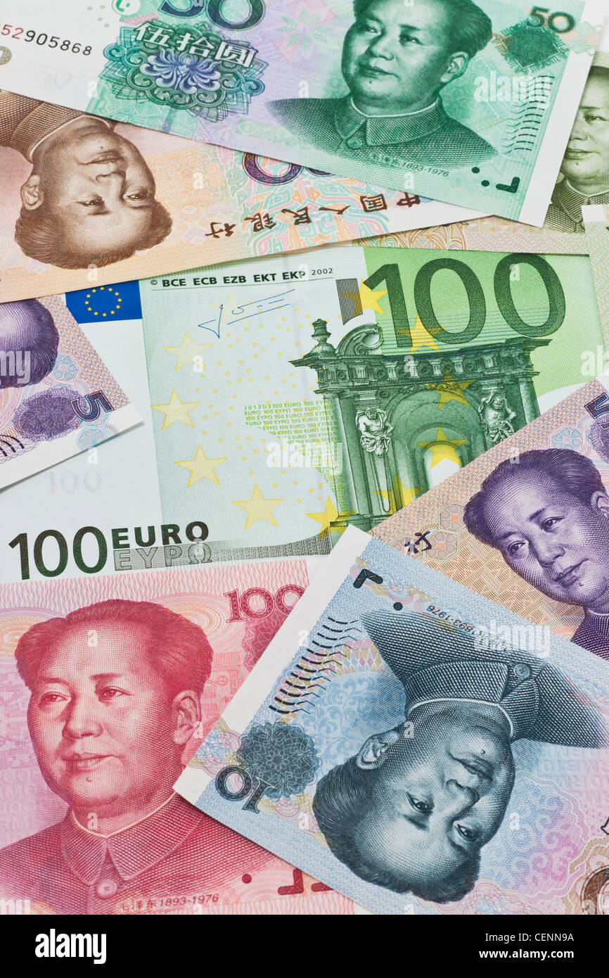 Many Yuan bills with the portrait of Mao Zedong lying side by side. In ...