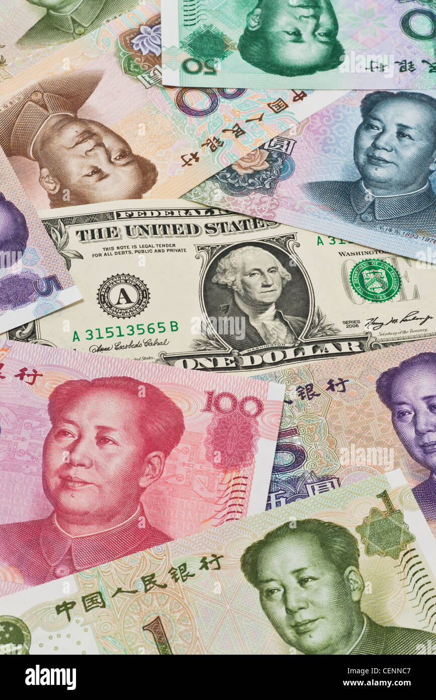 Many Yuan bills with the portrait of Mao Zedong lying side by side. In ...