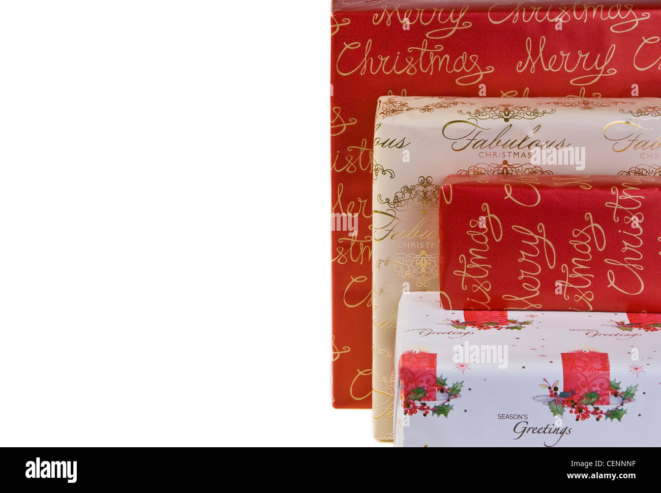 A pile of presents gift wrapped in Christmas paper Stock Photo - Alamy