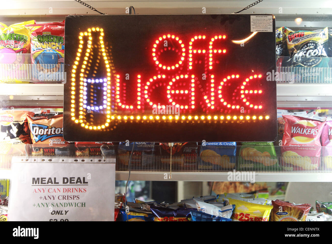 Neon Off Licence sign in a newsagents shop window advertising alcohol ...