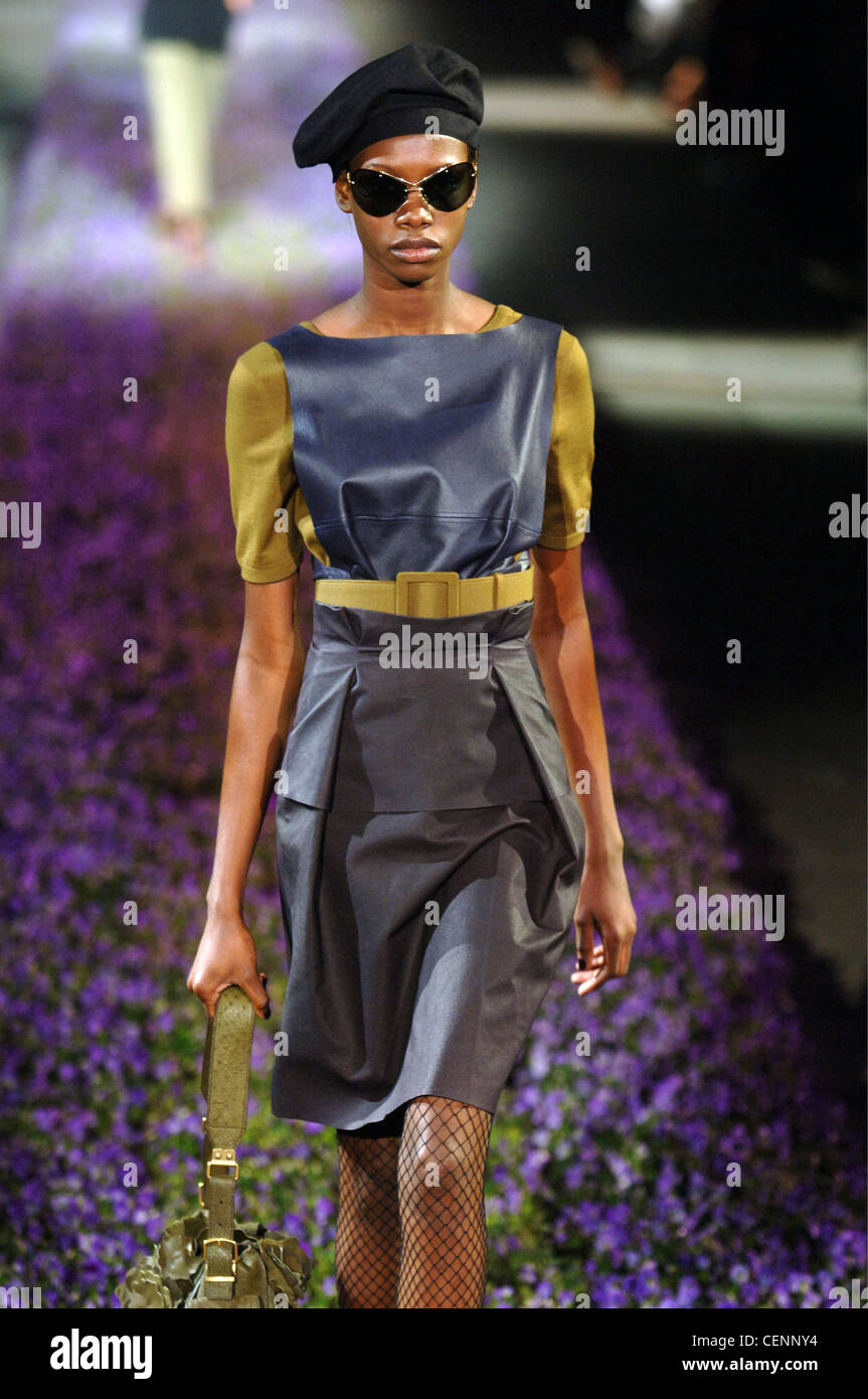 female model wearing a black beret and sunglasses a layered silk shift ...