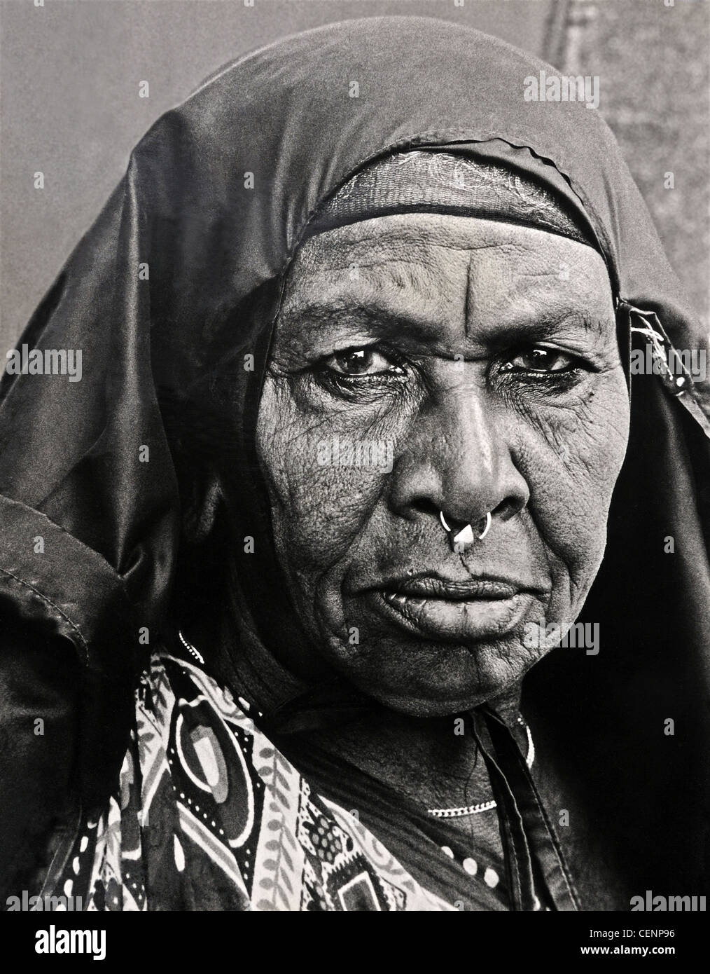 Old Swahili woman of Lamu Island wearing the black buibui head cloth ...