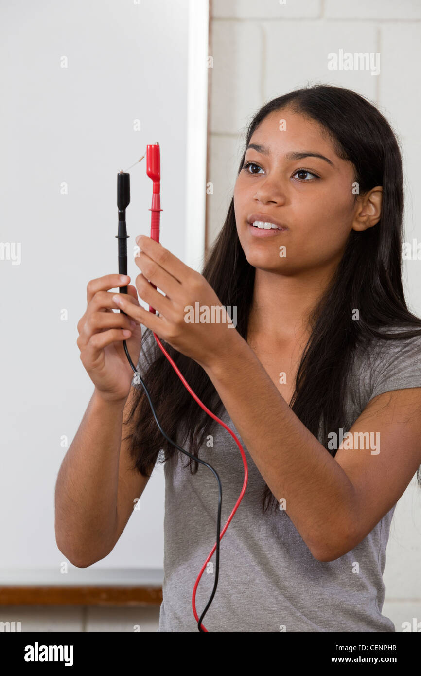 Engineering student connecting resistor using alligator clips Stock ...