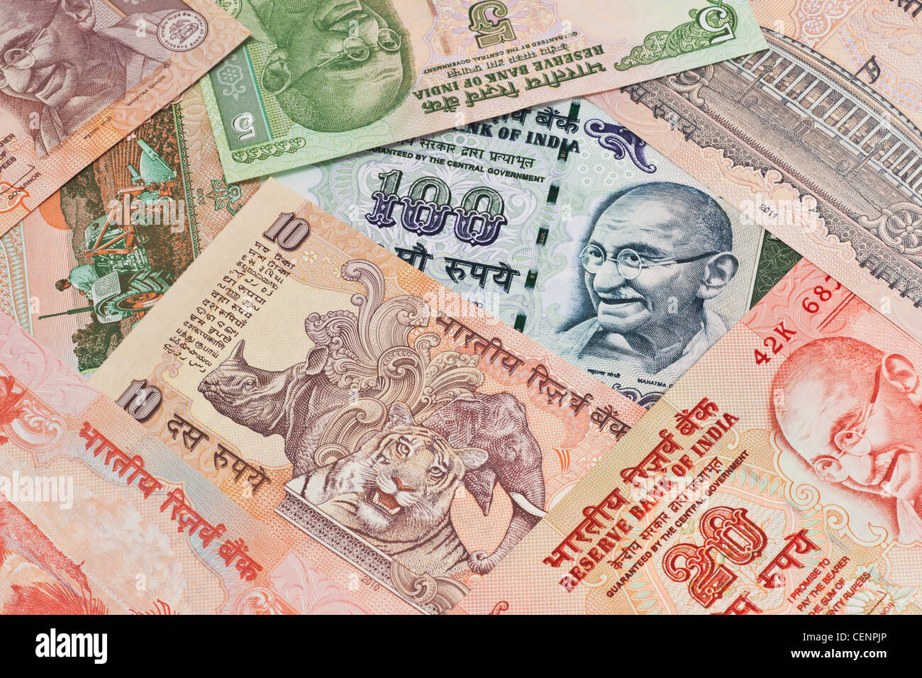 many Indian rupees bills with the portrait of Mahatma Gandhi lying side ...