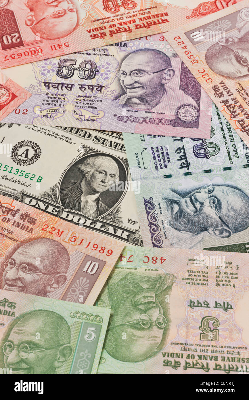 Many Indian rupee bills with the portrait of Mahatma Gandhi lying side ...