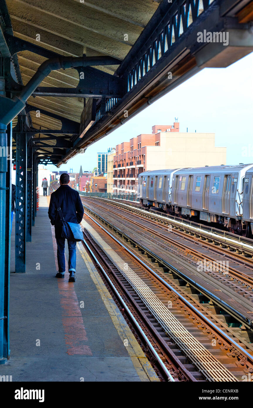 Man walking on subway platform Stock Photo - Alamy