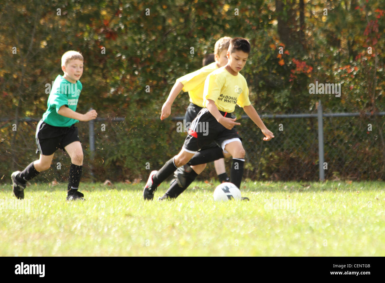 boys Soccer game in action chasing for the ball Stock Photo - Alamy