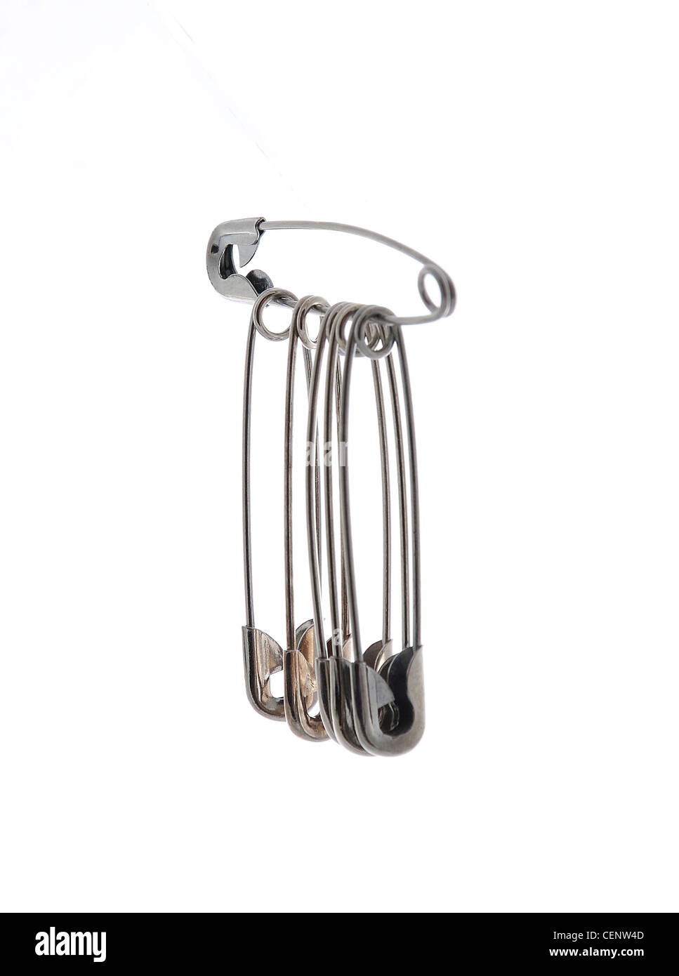 Metal hanged safety pins isolation on white background Stock Photo - Alamy