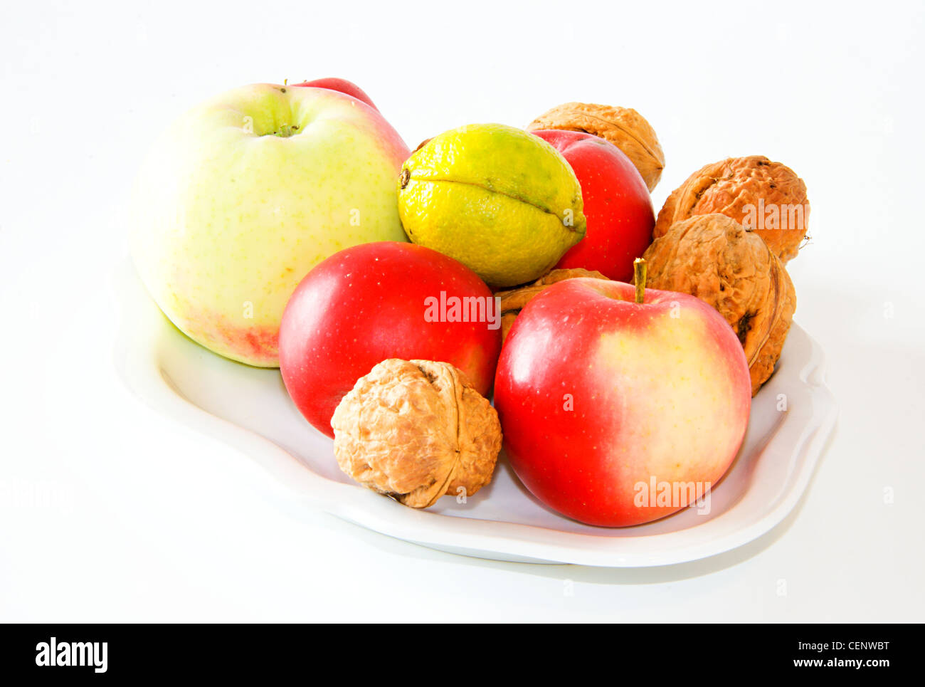 Autumn fruits in white plate Stock Photo - Alamy