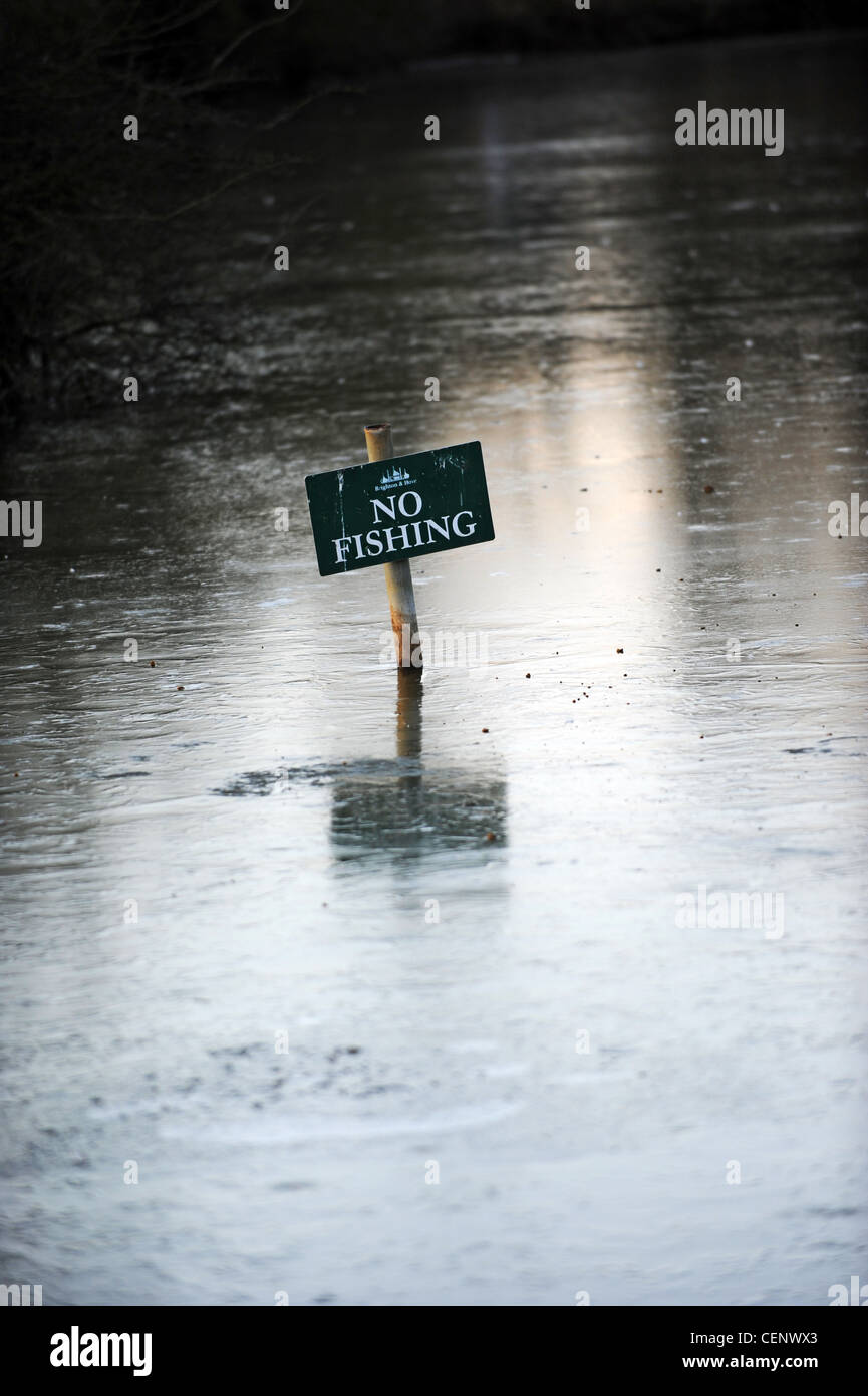No fishing sign in an icy pond Stock Photo - Alamy