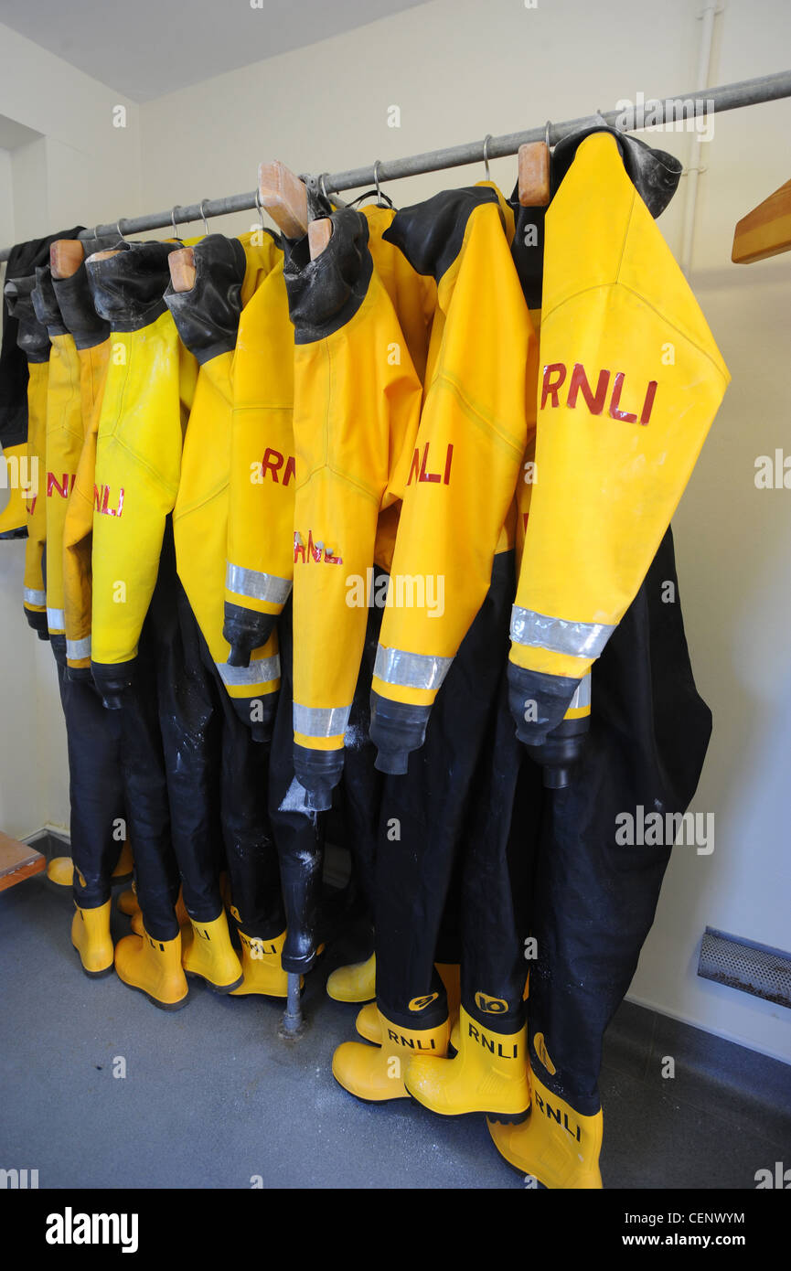 RNLI wet suits hanging up ready for the next emergency Stock Photo - Alamy