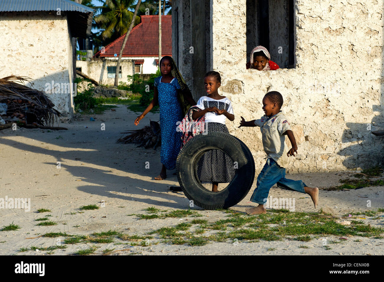 Boy rolling tire hi-res stock photography and images - Alamy