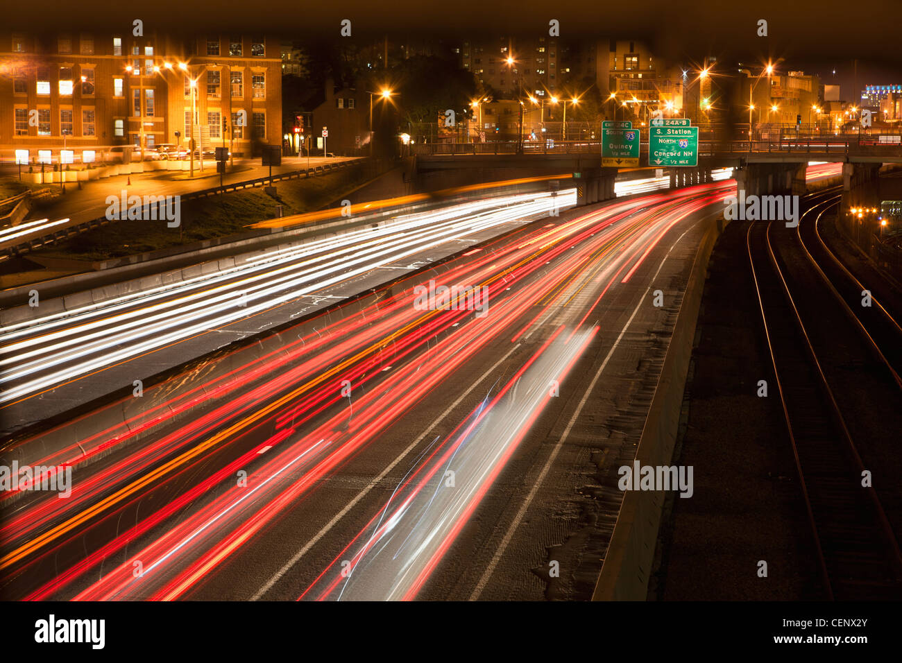 Streaks of lights of moving vehicles on the road, Mass Turnpike, Boston ...