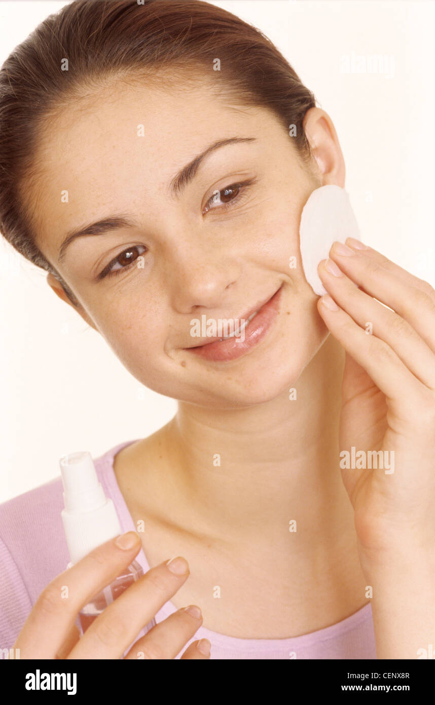 Beauty and Lifestyle: Young brunette female her hair pulled back ...