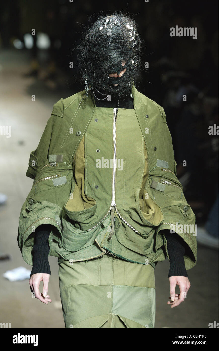 Junya Watanabe Model wearing black mask made from black hair, silver ...