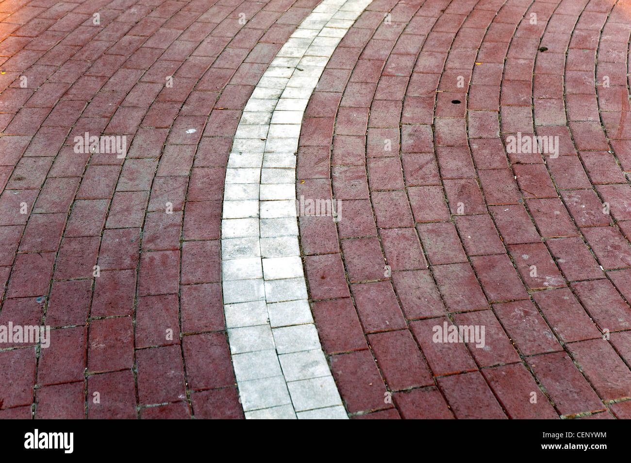 Curved White Line on Red Brick Pavement – Abstract Urban Street Design Stock Photo - Alamy