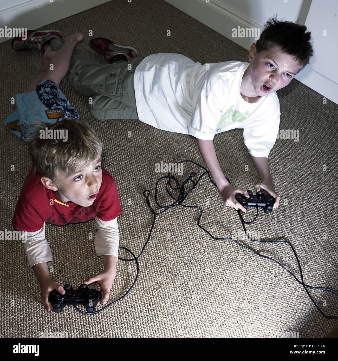Two male children playing computer games Stock Photo - Alamy