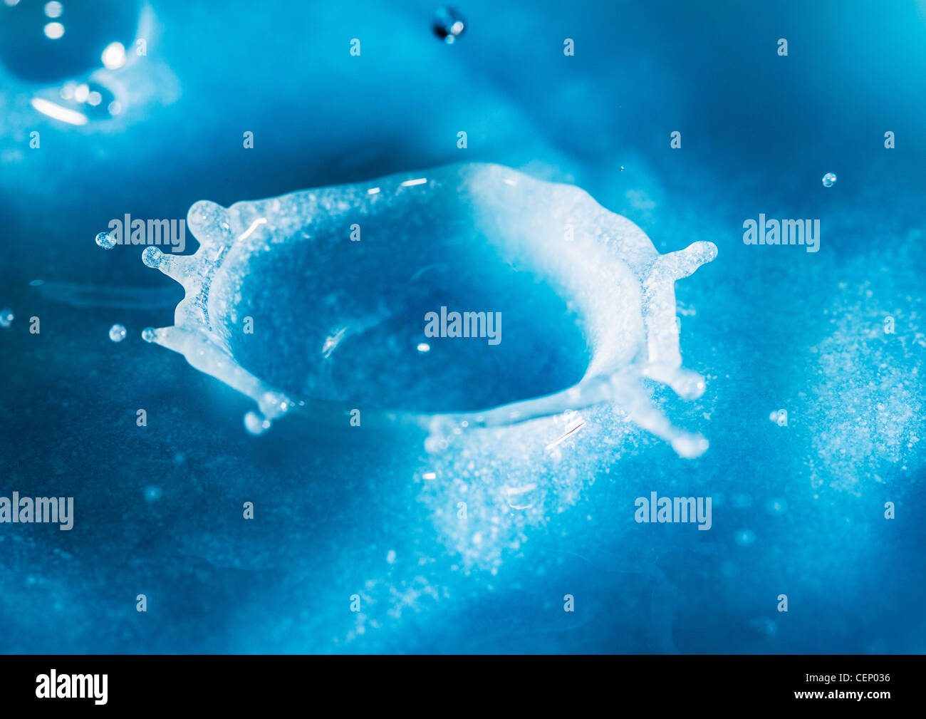 Shapes created by drops of milk and milk splashes Stock Photo - Alamy