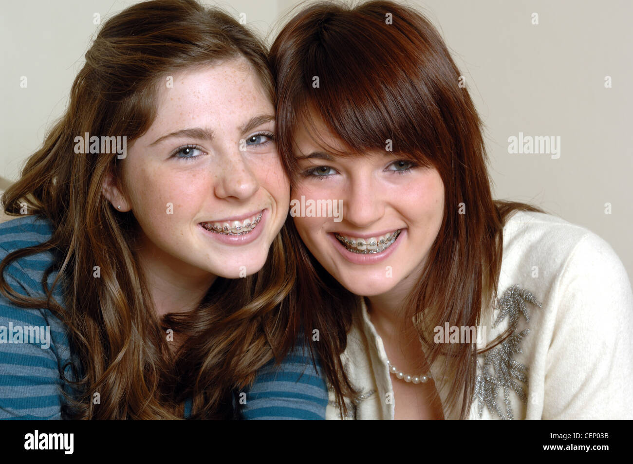Two Female teenagers smiling to camera Stock Photo - Alamy