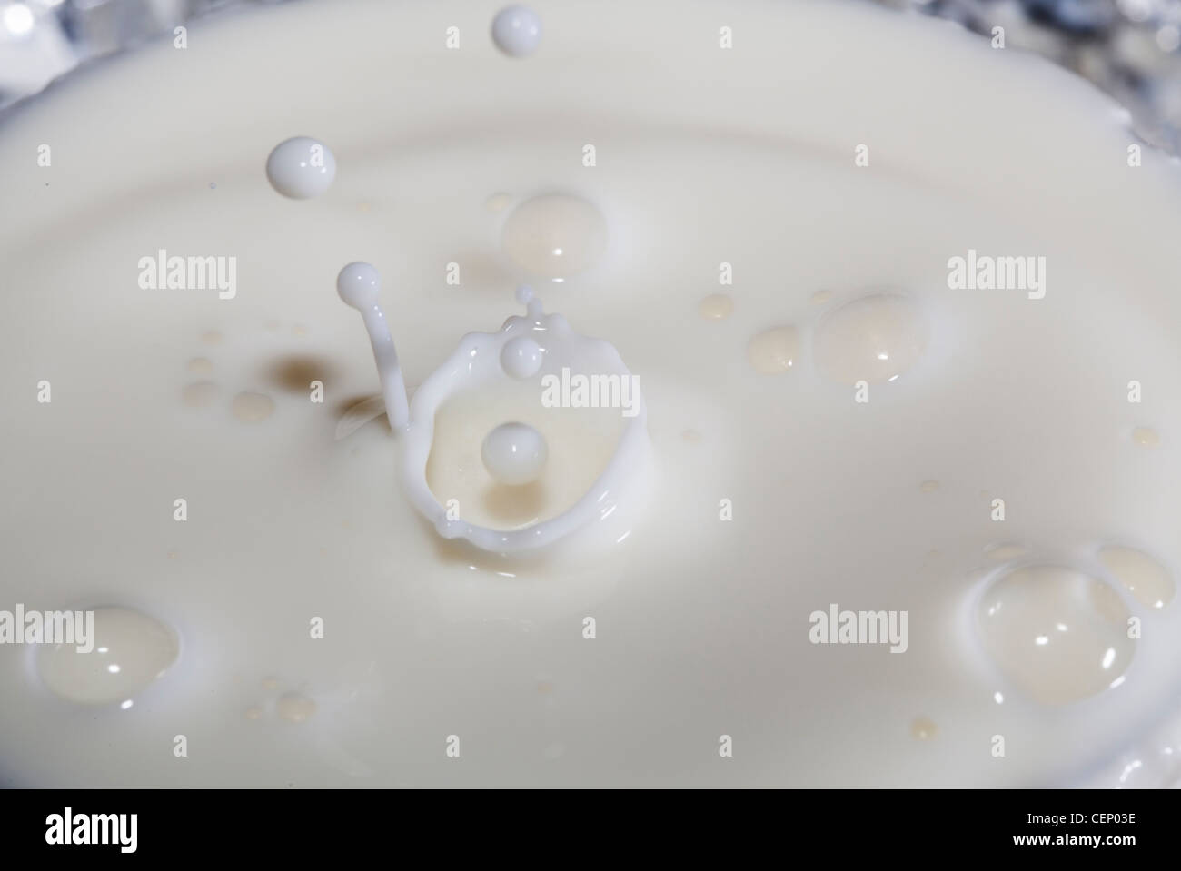 Shapes created by drops of milk and milk splashes Stock Photo - Alamy
