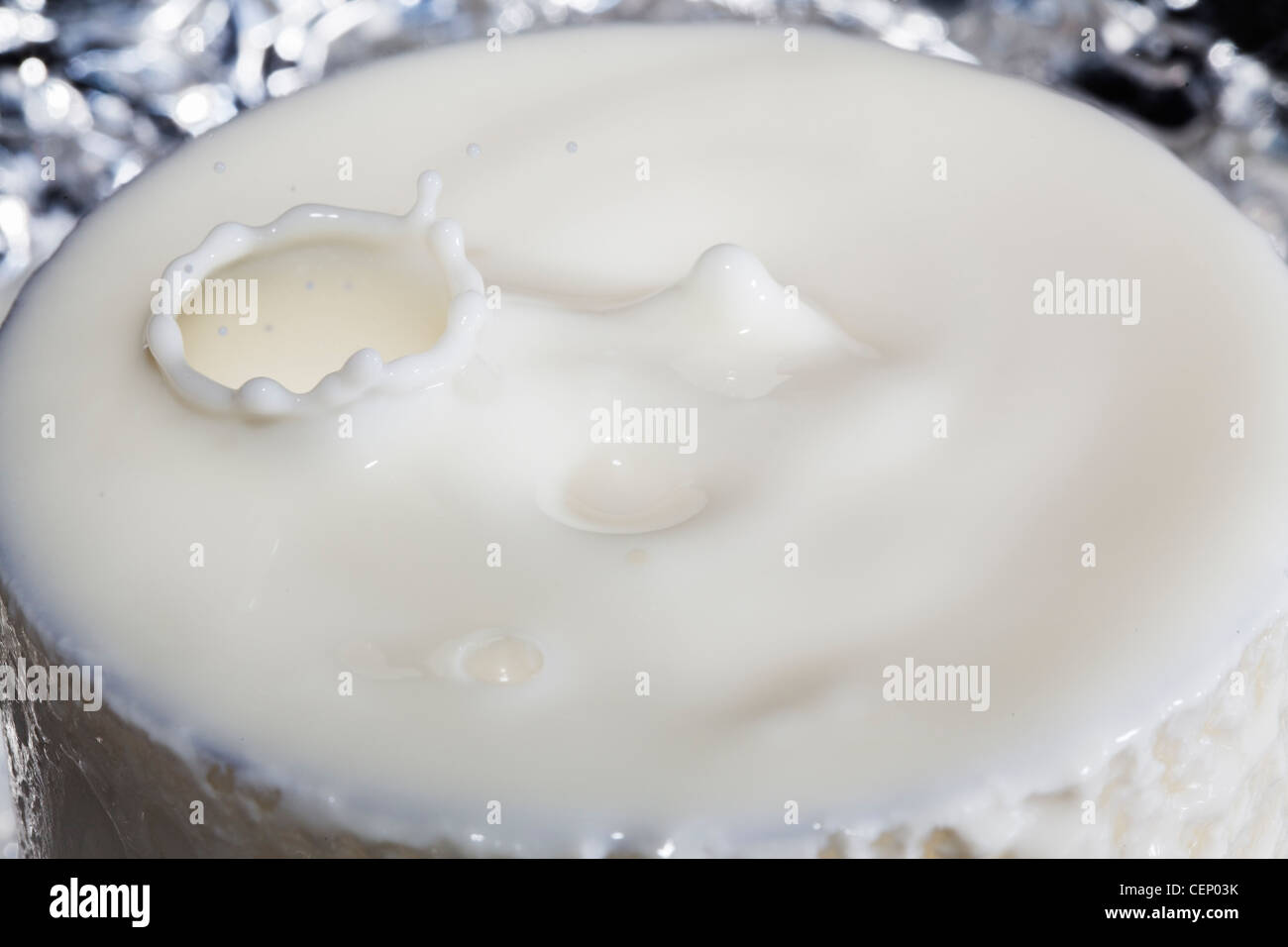 Shapes created by drops of milk and milk splashes Stock Photo - Alamy