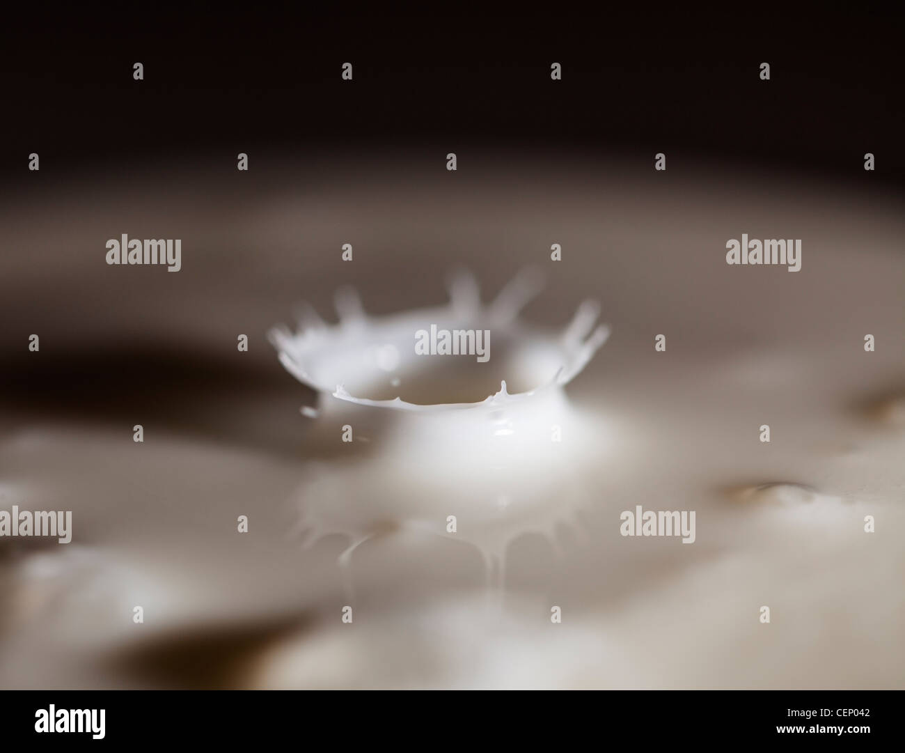 Shapes created by drops of milk and milk splashes Stock Photo - Alamy